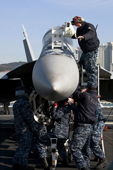 Us Navy Crewmen Work On Fa18ef Editorial Stock Photo - Stock Image ...