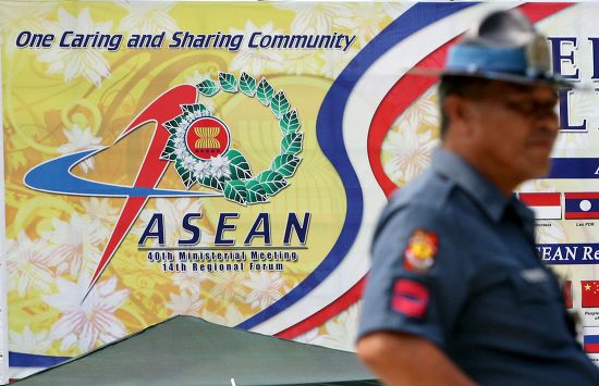 Filipino Policeman Stands Before Asean Banner Editorial Stock Photo ...