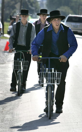 Amish Boys On Scooters Ride Past Editorial Stock Photo - Stock Image ...