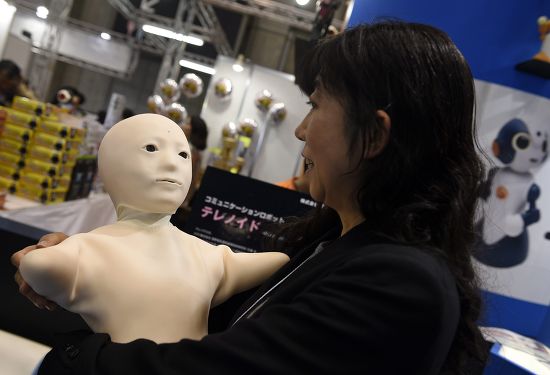 Portable Teleoperated Android Robot Telenoid Communicates Editorial ...