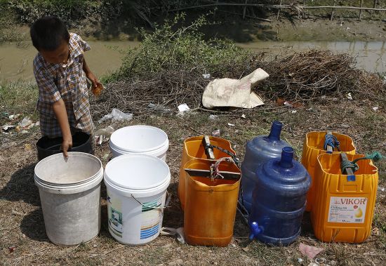 Child Puts Water Bucket Lined Buckets Editorial Stock Photo - Stock ...