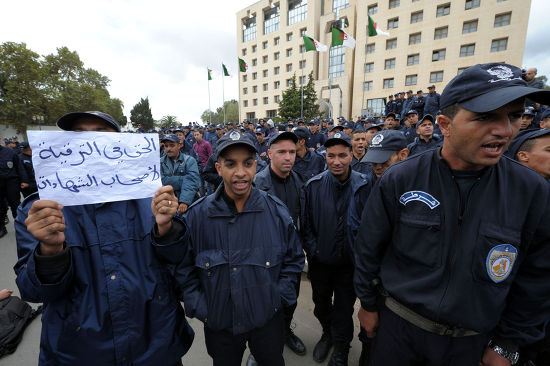 Algerian Policeman Holds Placard Saying Arabic Editorial Stock Photo ...