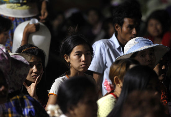 Workers Sit Outside Their Factory During Editorial Stock Photo - Stock ...
