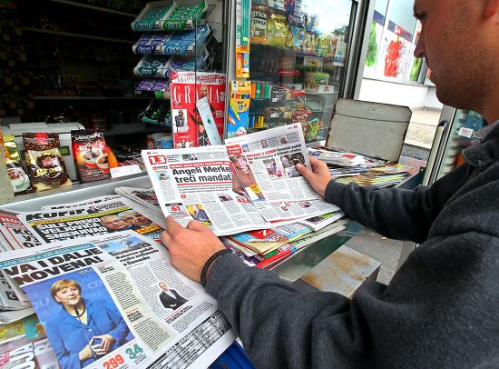 Man Buys Local Daily Newspaper Picture Editorial Stock Photo - Stock ...