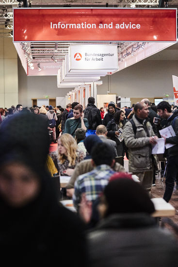 Visitors Walk Between Exhibition Stands During Editorial Stock Photo ...
