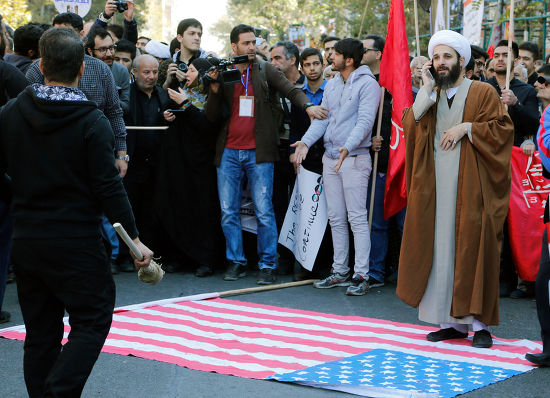 Iranian Cleric Stands On Us Flag Editorial Stock Photo - Stock Image ...