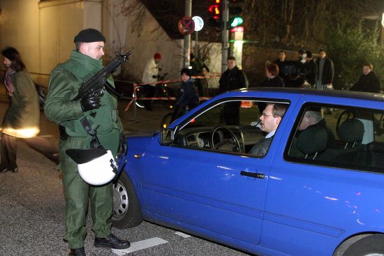 Armed Police Stop Vehicles Outside German Editorial Stock Photo - Stock ...