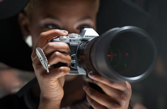 Model Holds Olympus Omd Camera During Editorial Stock Photo - Stock ...
