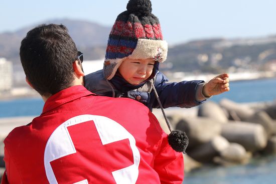 Greek Red Cross Worker Holds Migrant Editorial Stock Photo - Stock ...