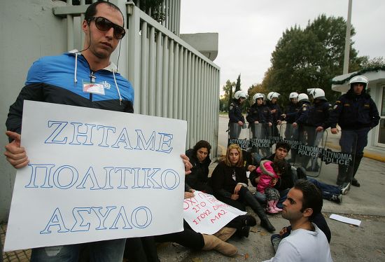 Iranian Refugee Holds Placard Reading We Editorial Stock Photo - Stock ...
