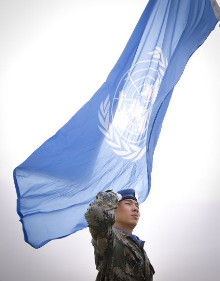 Chinese Soldier Salutes Un Flag During Editorial Stock Photo - Stock ...