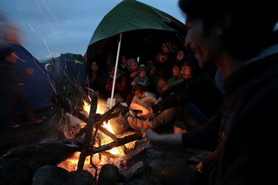 Refugees Chant Songs Around Fire Outside Editorial Stock Photo - Stock ...