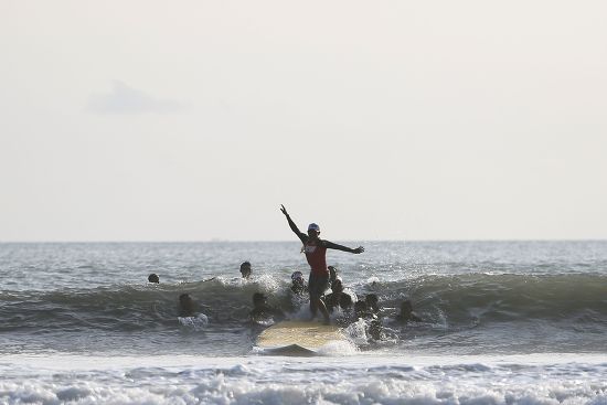 Balinese Man Rides Giant Surfboard During Editorial Stock Photo - Stock ...