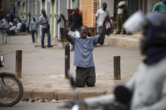 Man Kneels Down Prayer Police Officers Editorial Stock Photo - Stock ...