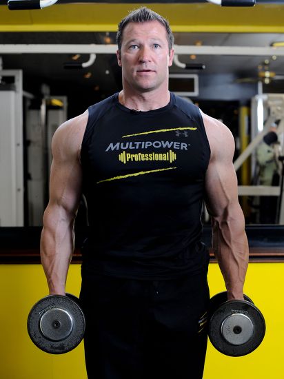 Bodybuilder Gunter Schlierkamp Demonstrates Lifting Technique Editorial ...