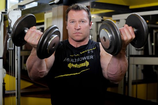 Bodybuilder Gunter Schlierkamp Demonstrates Lifting Technique Editorial ...