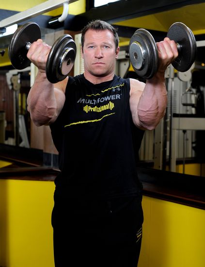 Bodybuilder Gunter Schlierkamp Demonstrates Lifting Technique Editorial ...