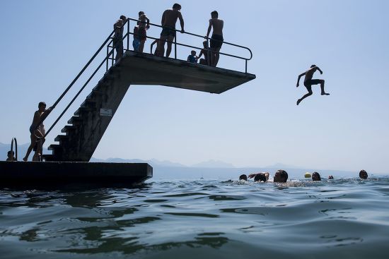 Man Jumps Diving Platform Into Water Editorial Stock Photo - Stock ...