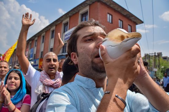 Young Man Blowing Conch Shell During Editorial Stock Photo - Stock ...