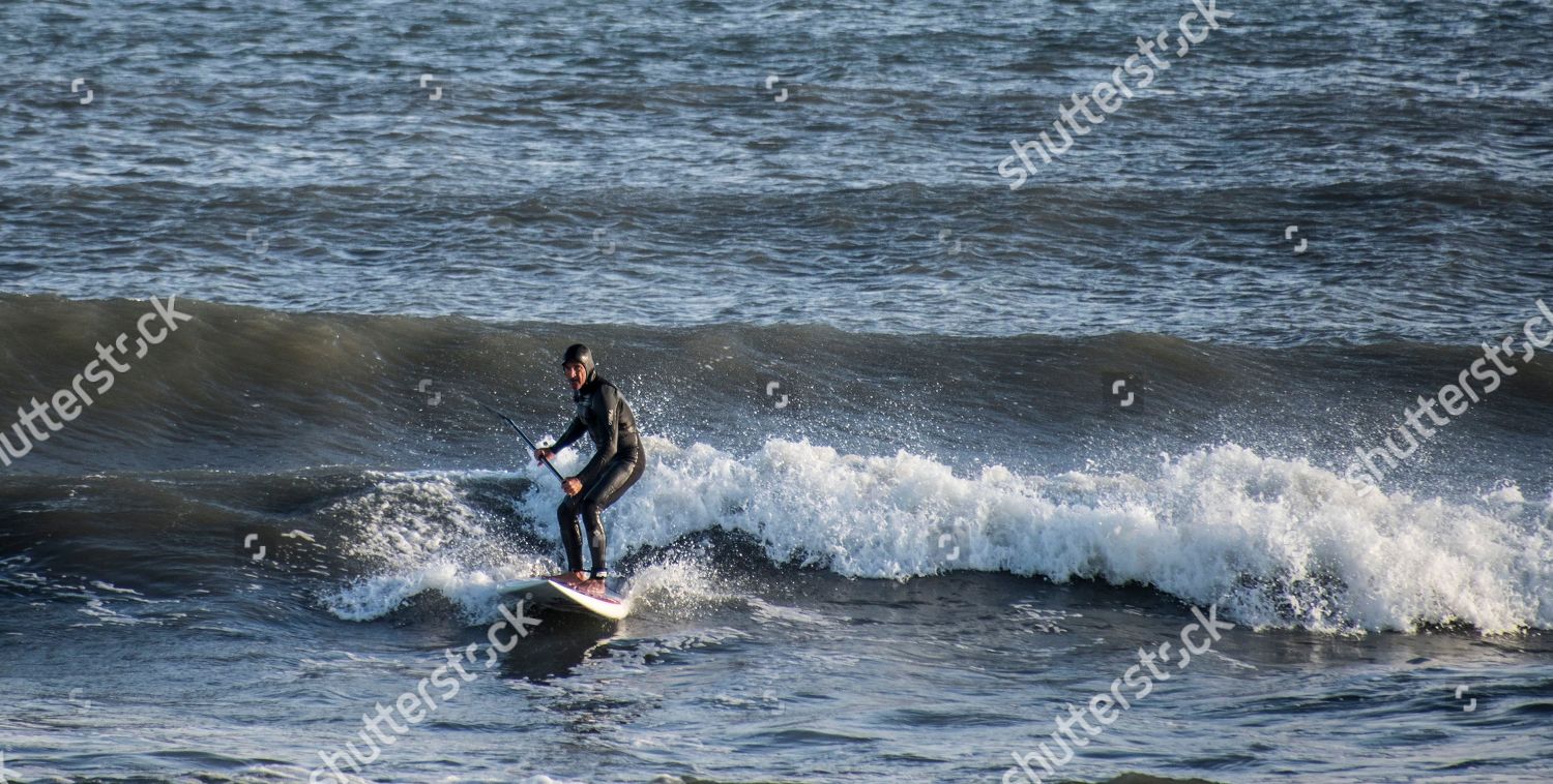 Sufer Enjoys Late Afternoon Ride On Editorial Stock Photo - Stock Image ...