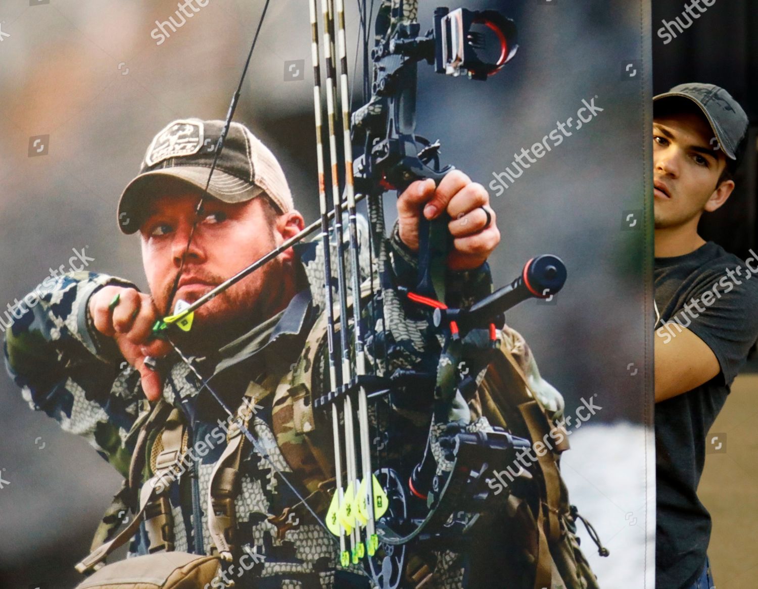 Salesman Looks Past Poster Bow Hunter Editorial Stock Photo - Stock ...