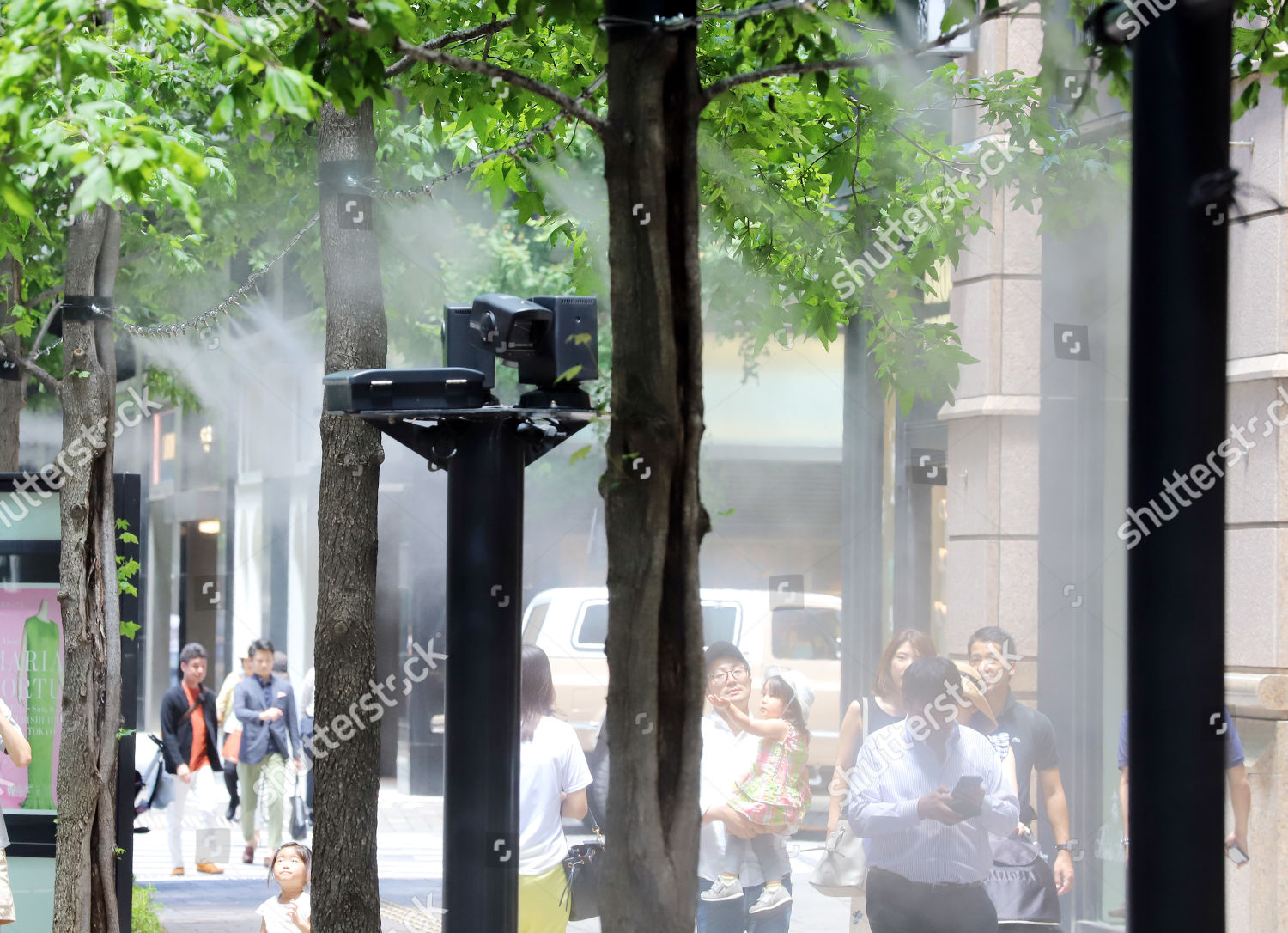 People Stroll Under Water Mist Sprayers Editorial Stock Photo - Stock ...