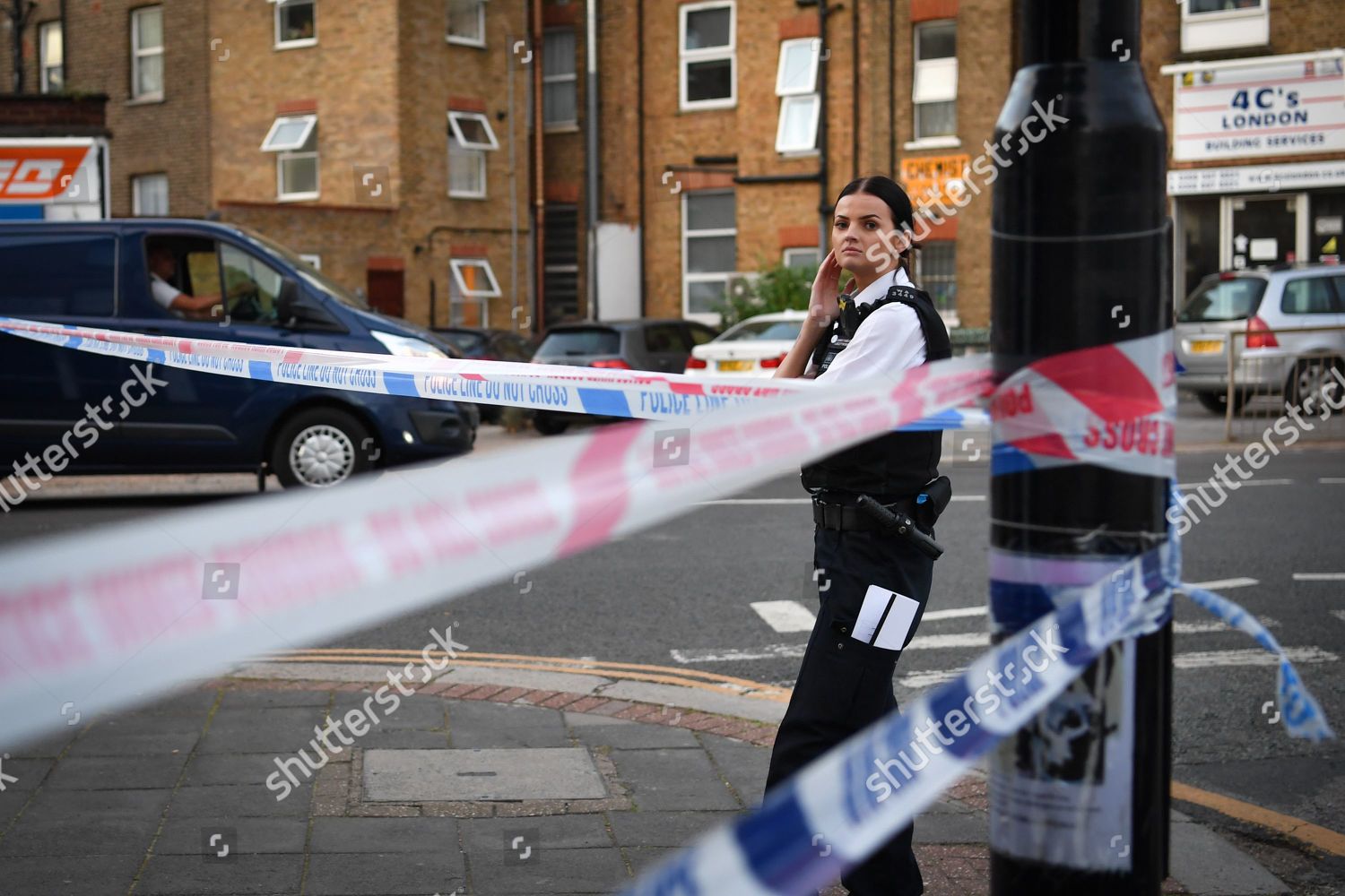 Police Officer Stands Over Crime Scene Editorial Stock Photo - Stock ...