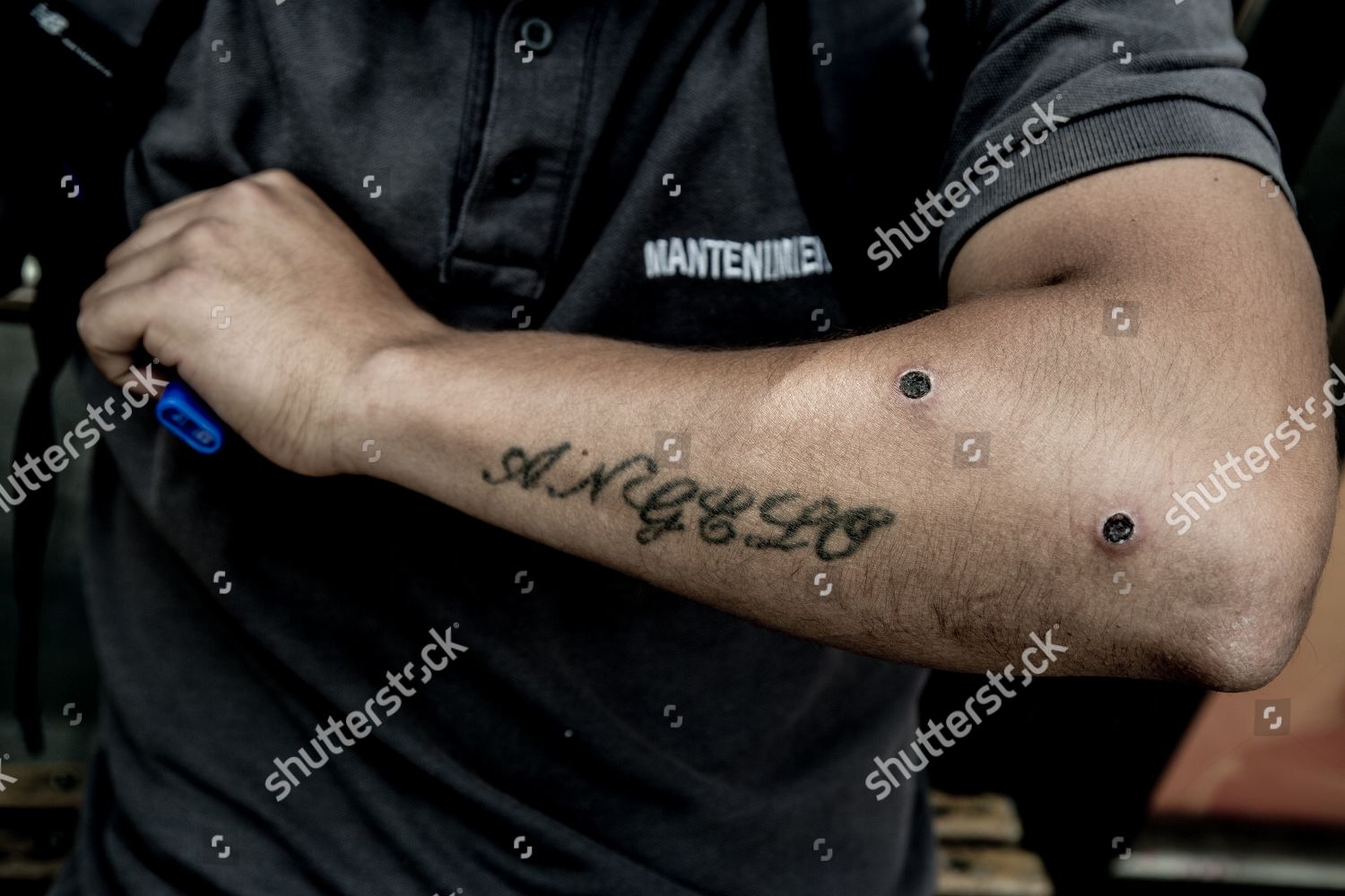 Bullet Hole Arm Tattoo