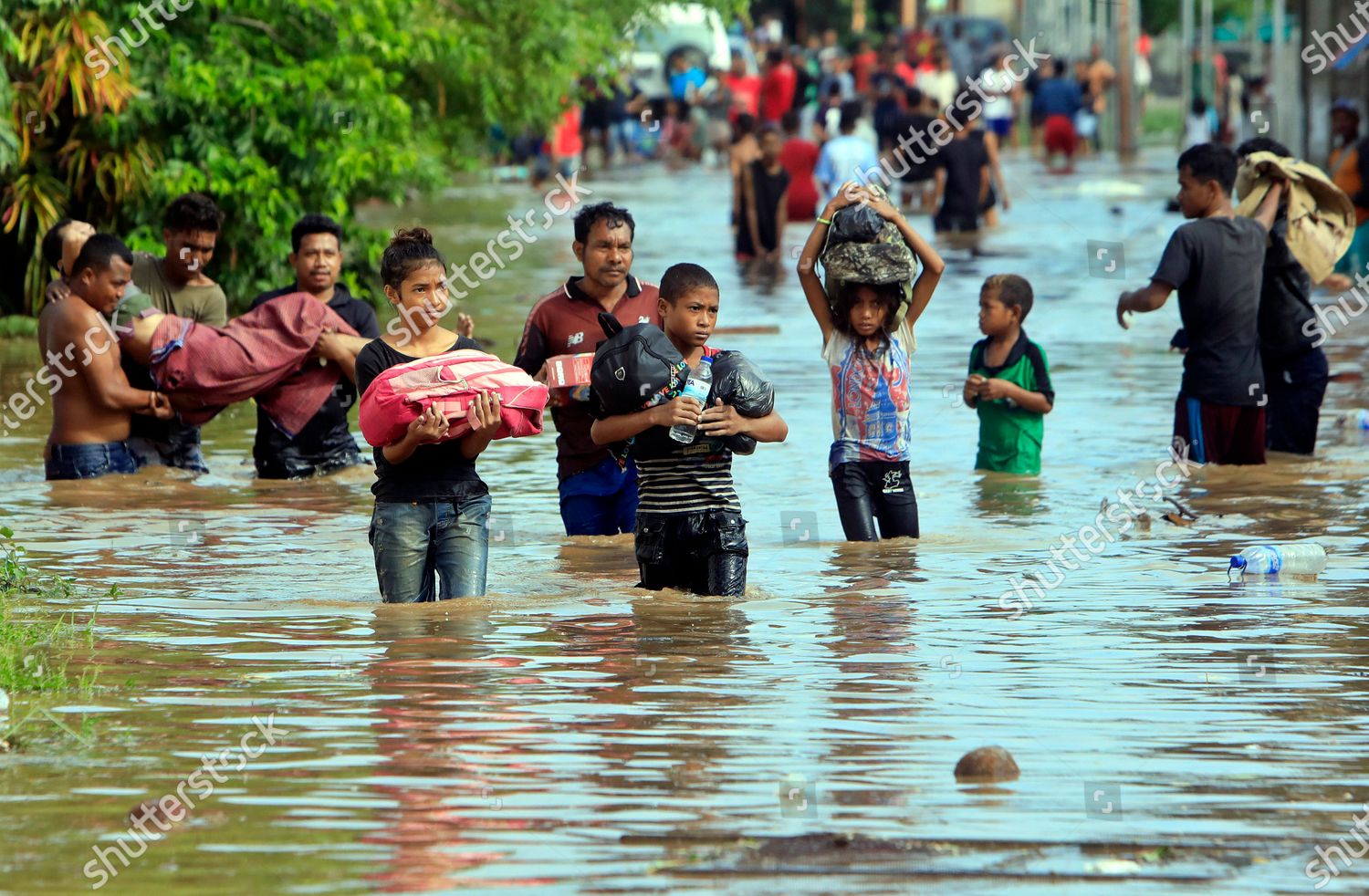 East Timorese People Navigate Flooded Street Editorial Stock Photo ...