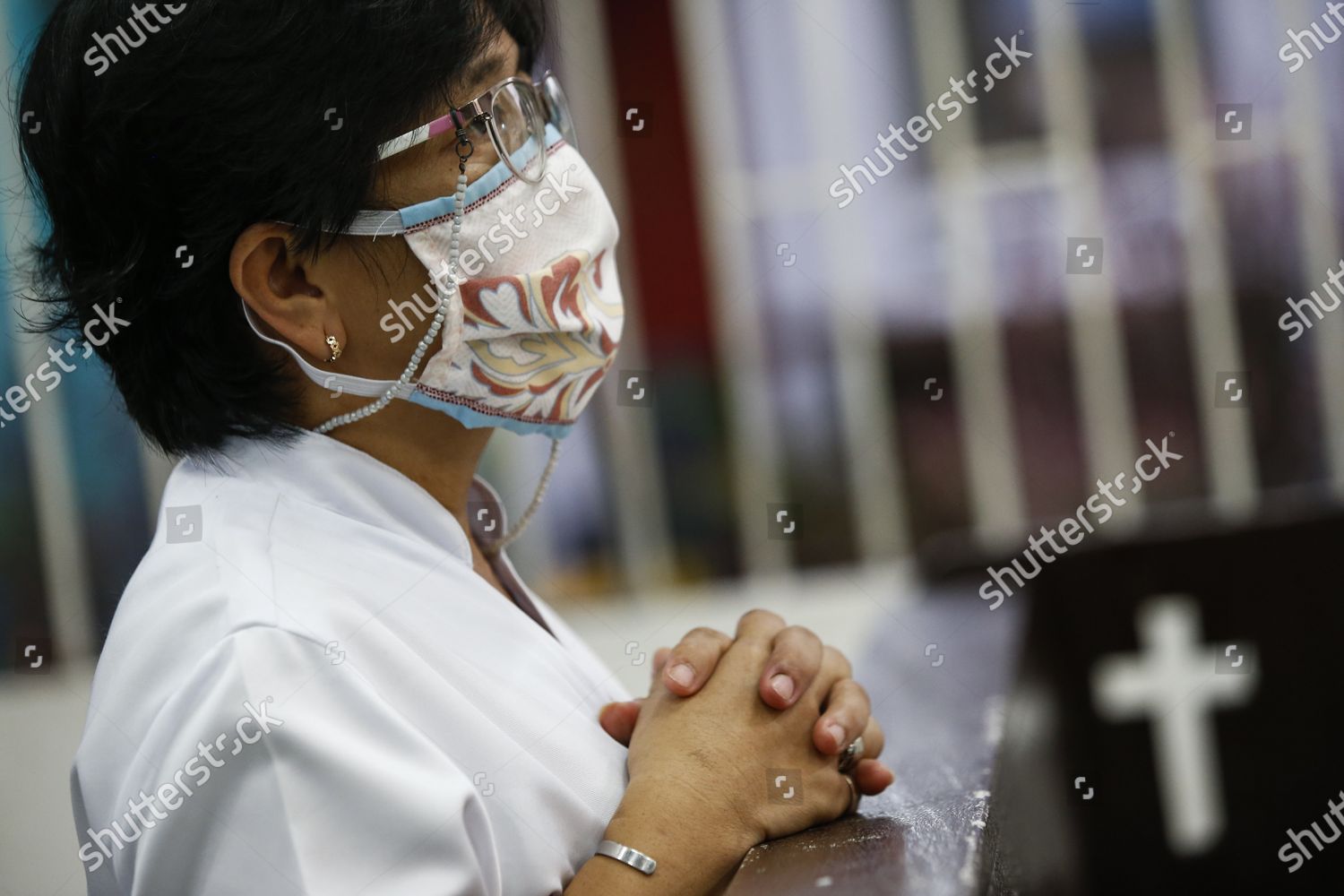 Catholic Church Staff Member Prays During Editorial Stock Photo - Stock ...