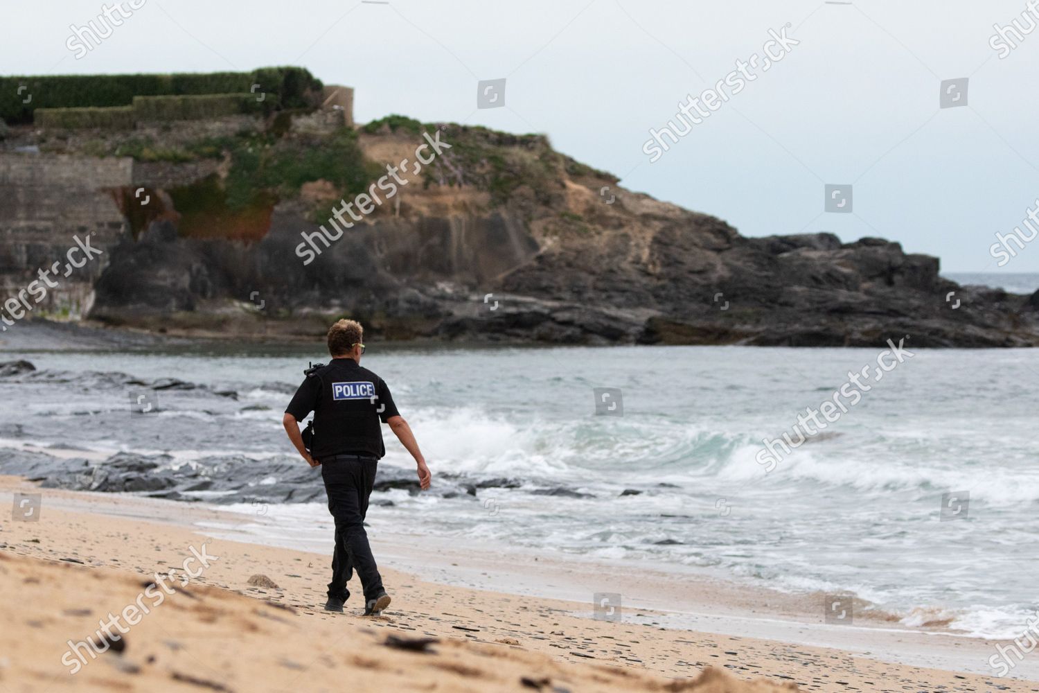 Police Officer Walks Along Constantine Bay Editorial Stock Photo ...