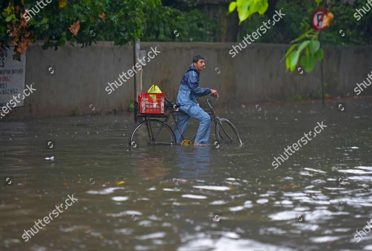 Cyclist Wade Through Water Logged Street Editorial Stock Photo - Stock ...