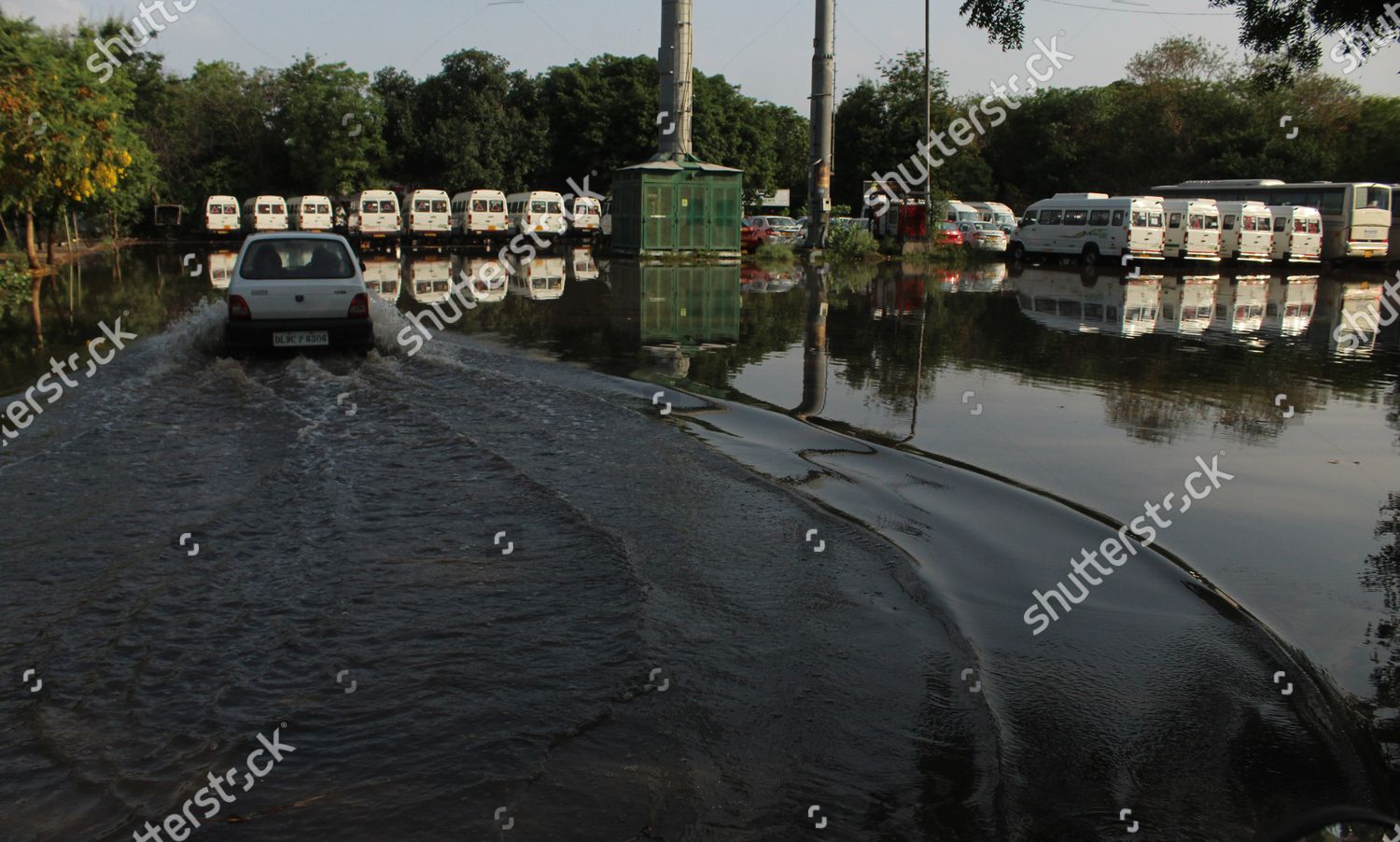 Car Crosses Waterlogged Road After Rain Editorial Stock Photo - Stock ...