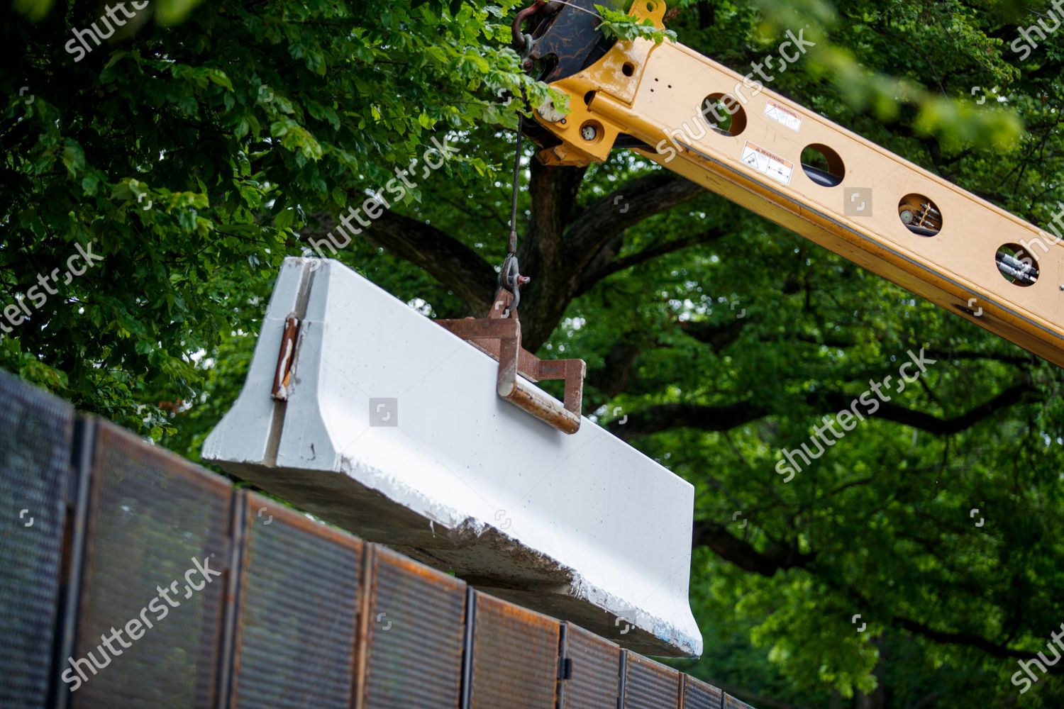 Crane Lifts Concrete Barriers Onto Flatbed Editorial Stock Photo ...