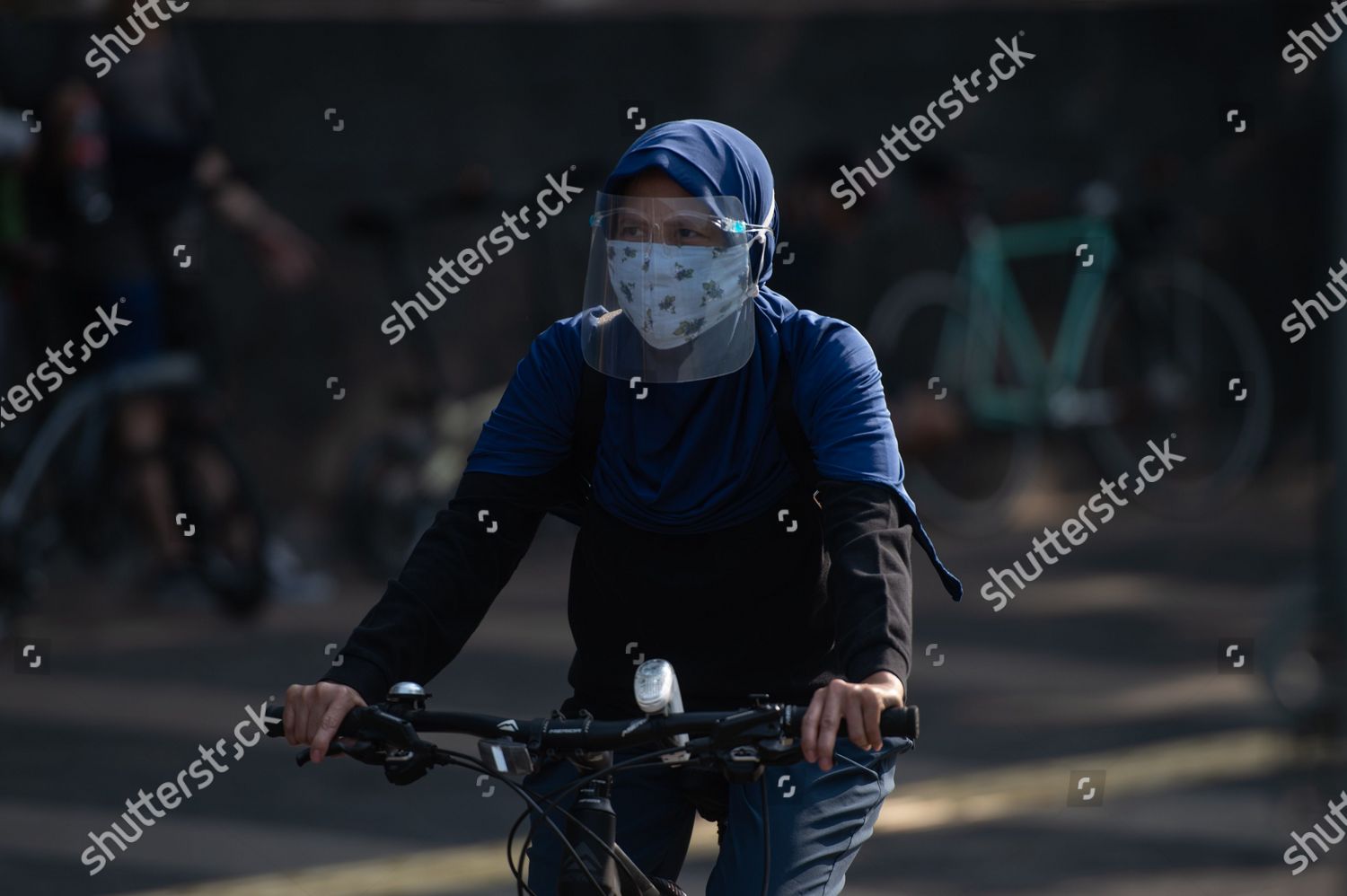 Woman Wearing Face Shield Rides Bicycle Editorial Stock Photo - Stock ...