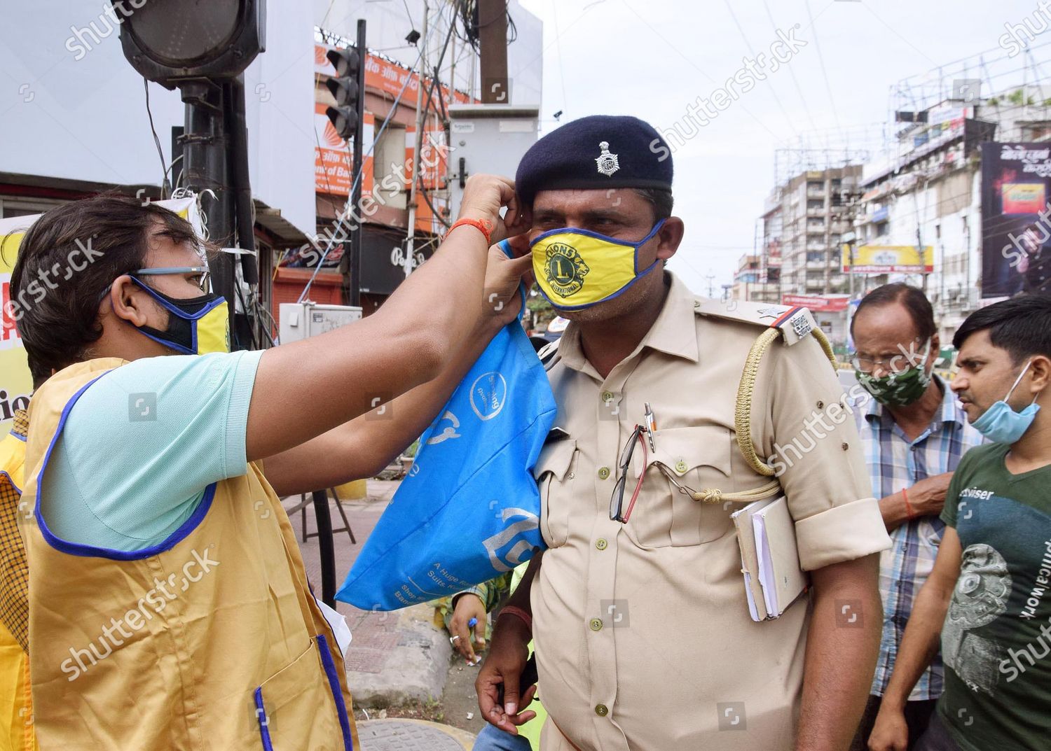 Volunteer Helps Police Personnel Put On Editorial Stock Photo - Stock ...