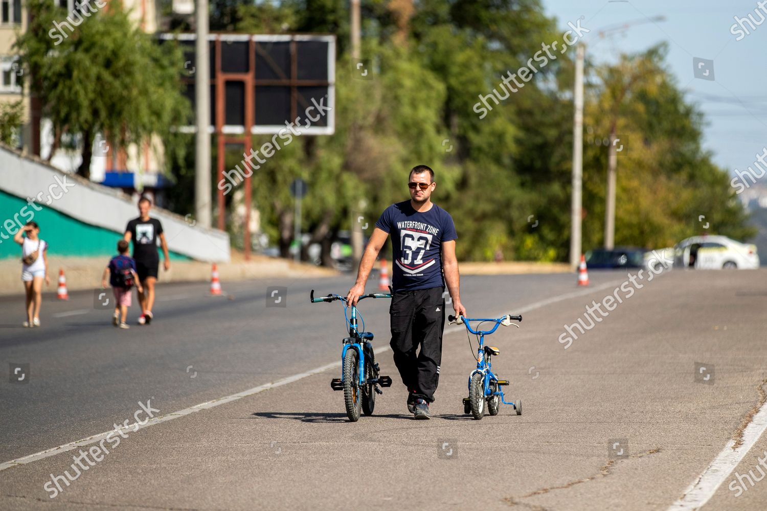 Man Walks 2 Small Bicycles Bike Editorial Stock Photo - Stock Image ...