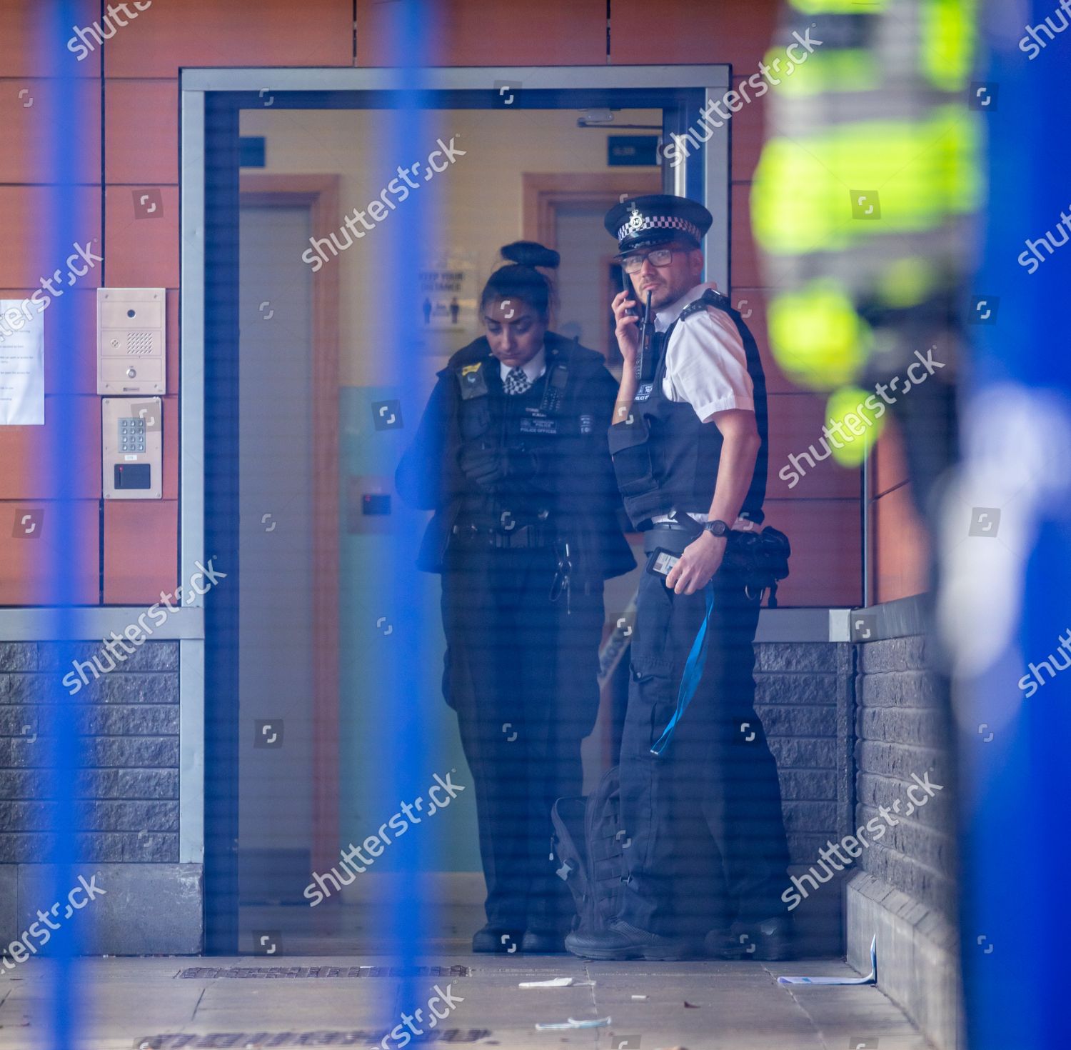 POLICE OFFICERS STAND GUARD INSIDE STATION Editorial Stock Photo ...