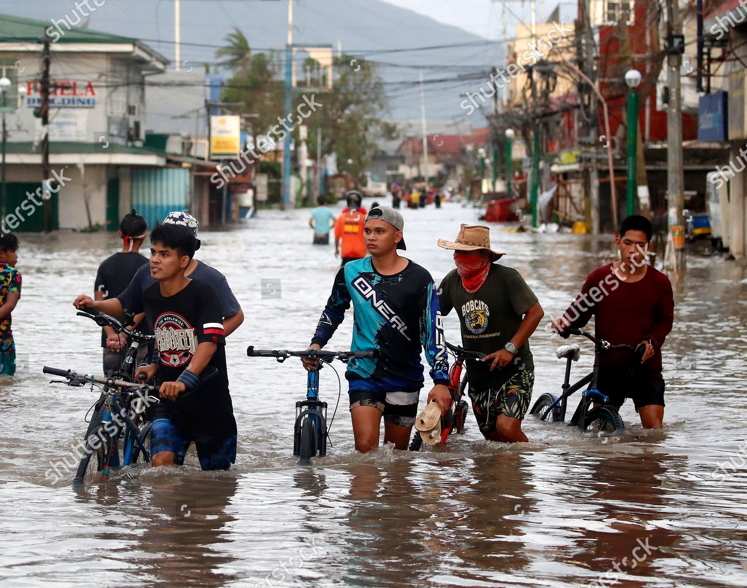 Filipino Villagers Wade Along Flooded Road Editorial Stock Photo - Stock Image | Shutterstock