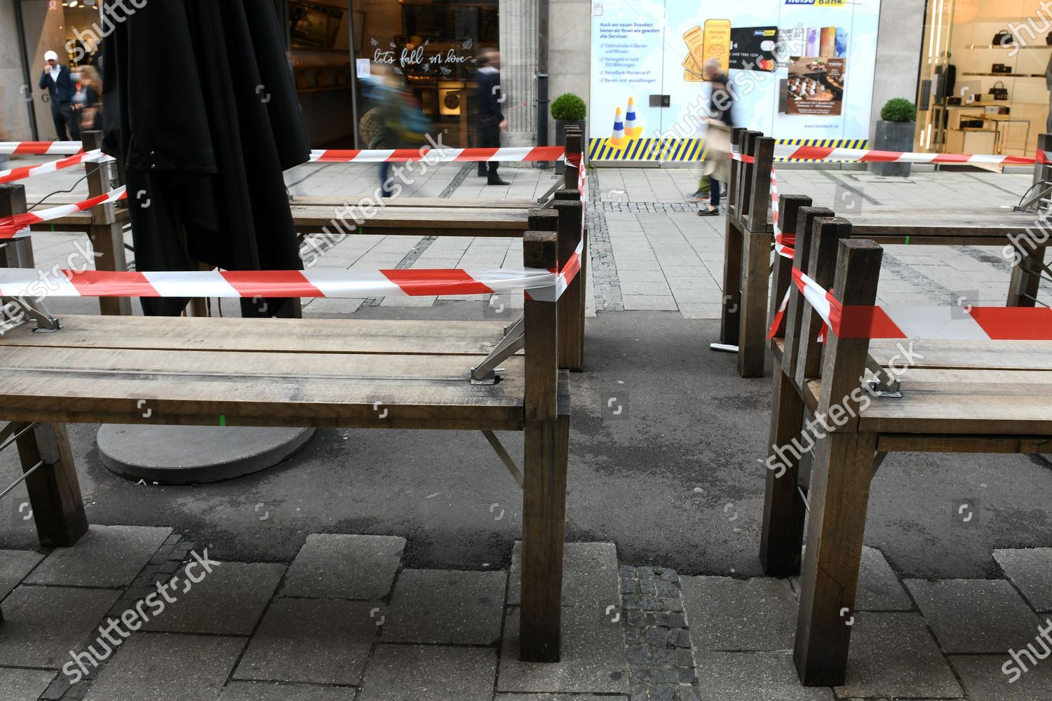 Pedestrians Walk Past Stacked Tables Closed Editorial Stock Photo ...