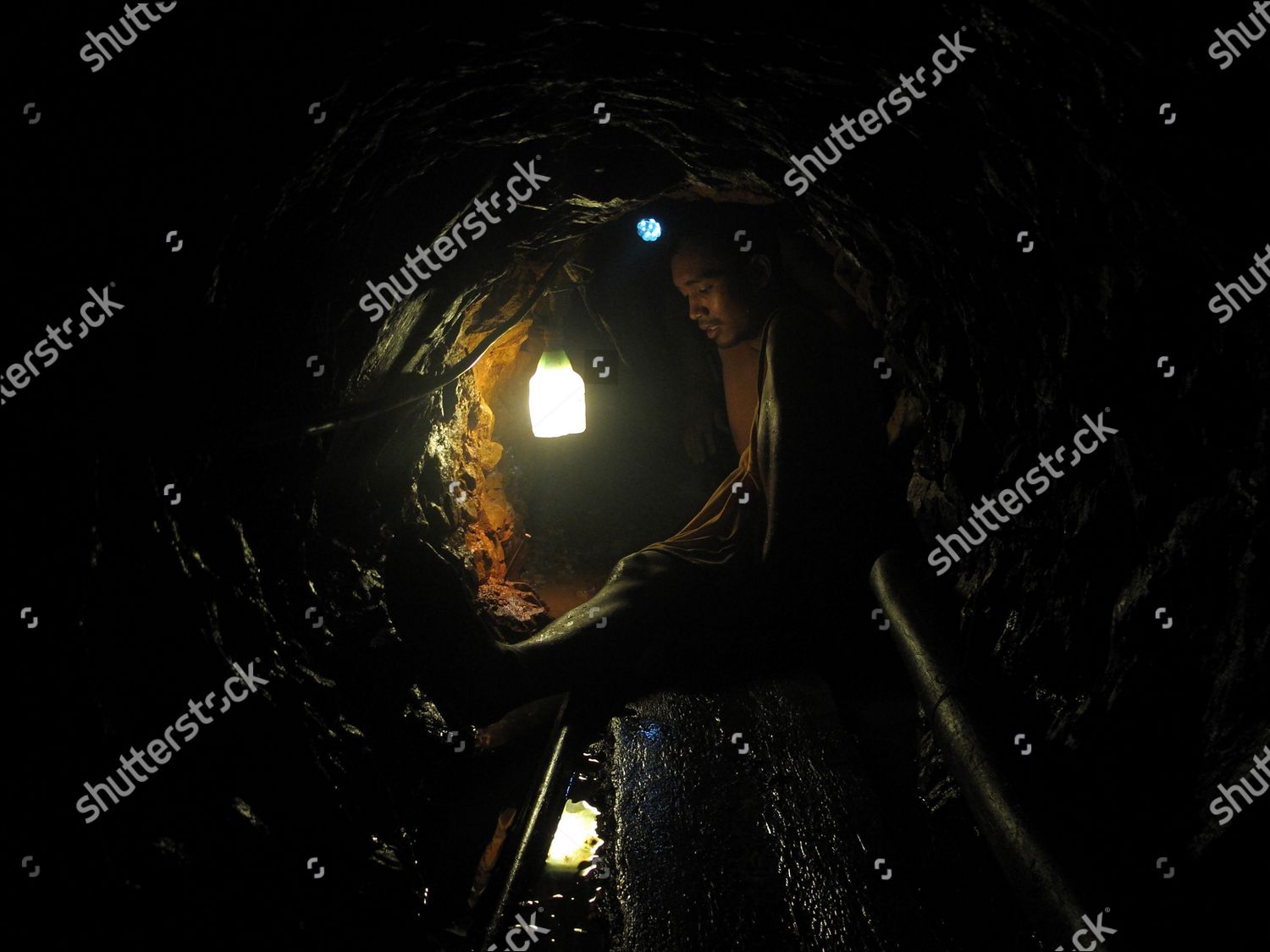Miner Resting Inside Sinking Tunnel Sta Editorial Stock Photo - Stock ...