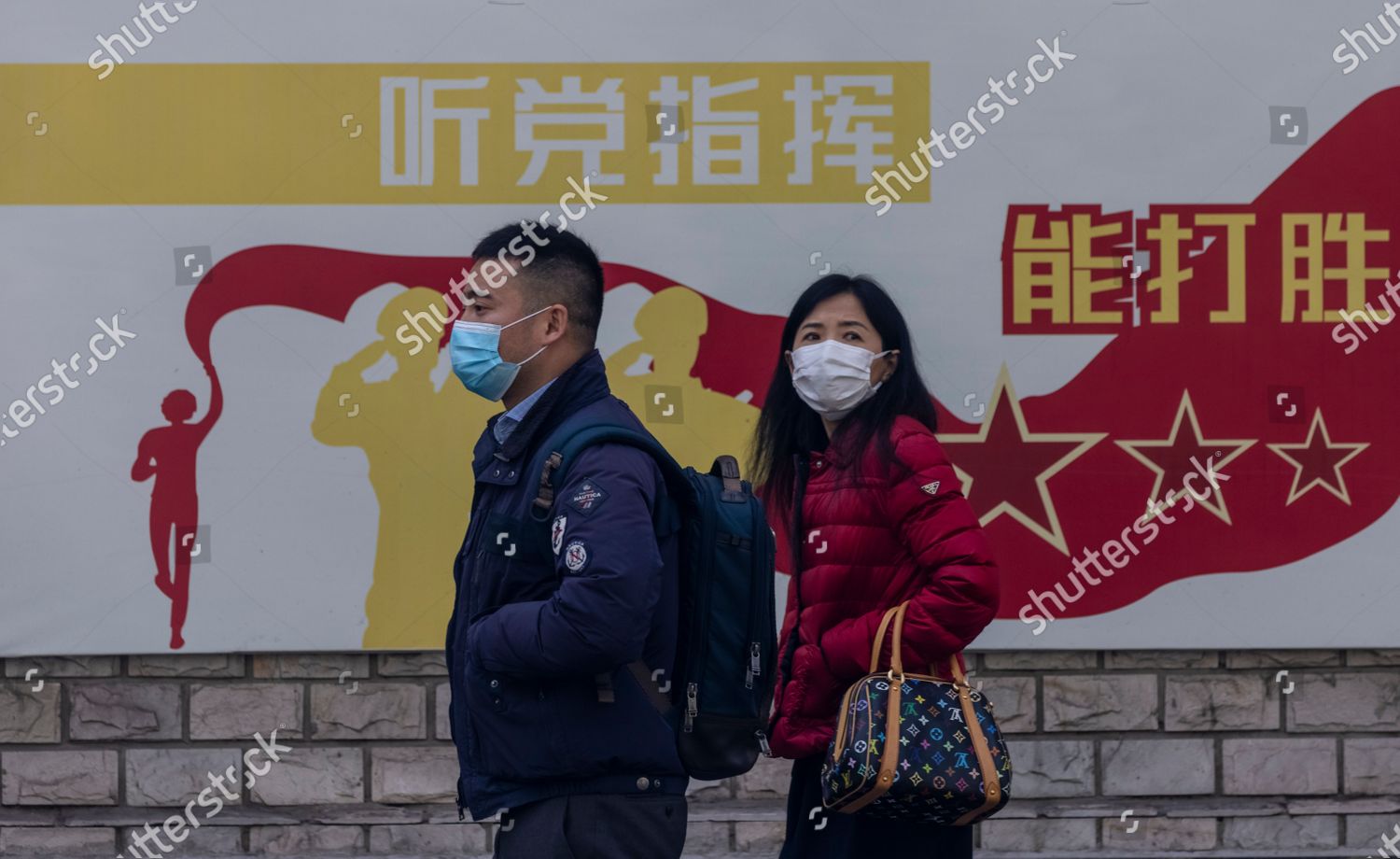COUPLE PASSES BY PROPAGANDA POSTER ON Editorial Stock Photo - Stock ...