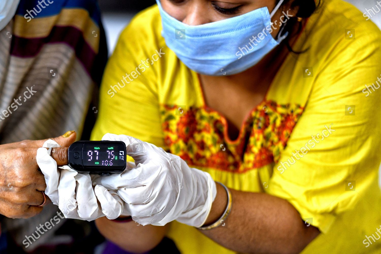 people-checking-oxygen-saturation-level-through-editorial-stock-photo