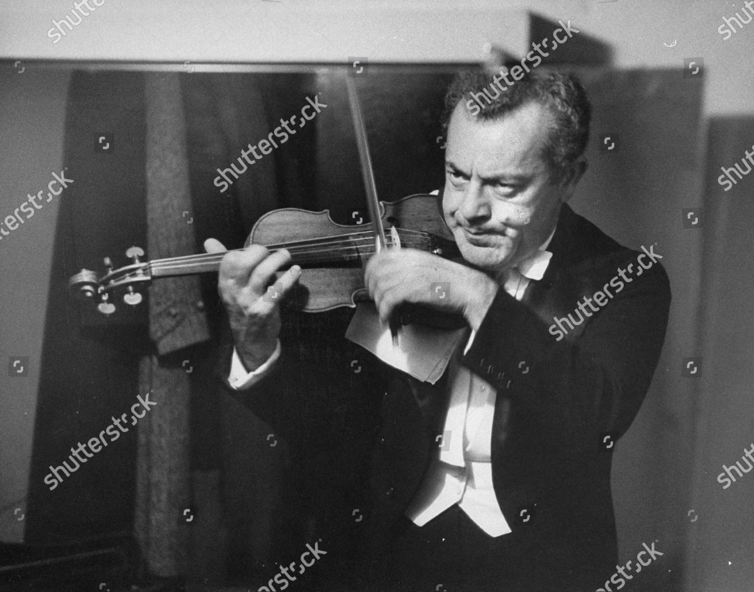 Violinist Alexander Schneider Tuning His Violin Editorial Stock Photo ...