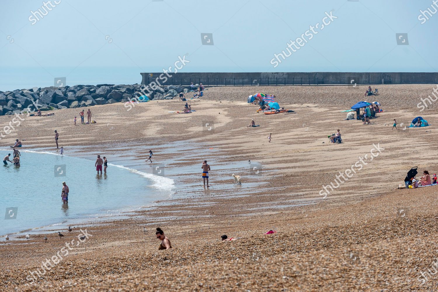 People On Shingle Beach Enjoying Sunshine Editorial Stock Photo - Stock ...