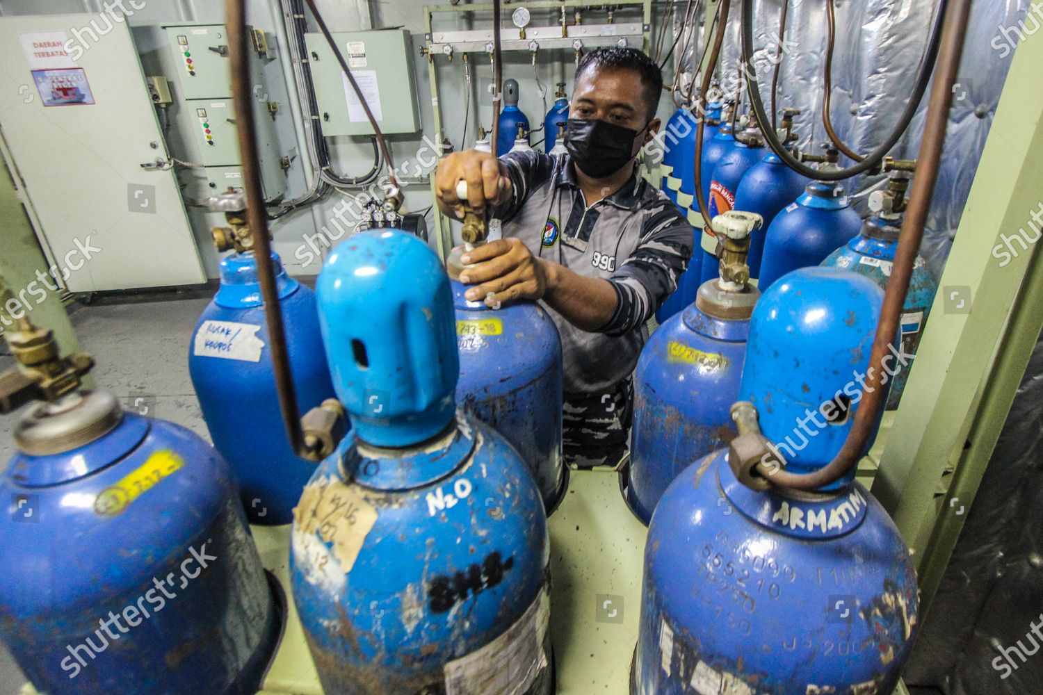 Indonesian Navy Officers Fill Oxygen Cylinders Editorial Stock Photo ...