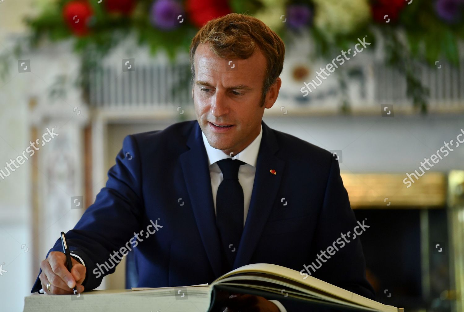 French President Emmanuel Macron Signs Guest Editorial Stock Photo ...