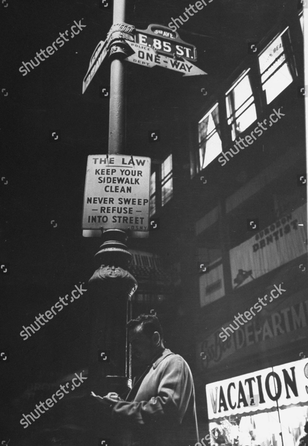 Man Leaning Against Lamp Post Reading Editorial Stock Photo - Stock ...