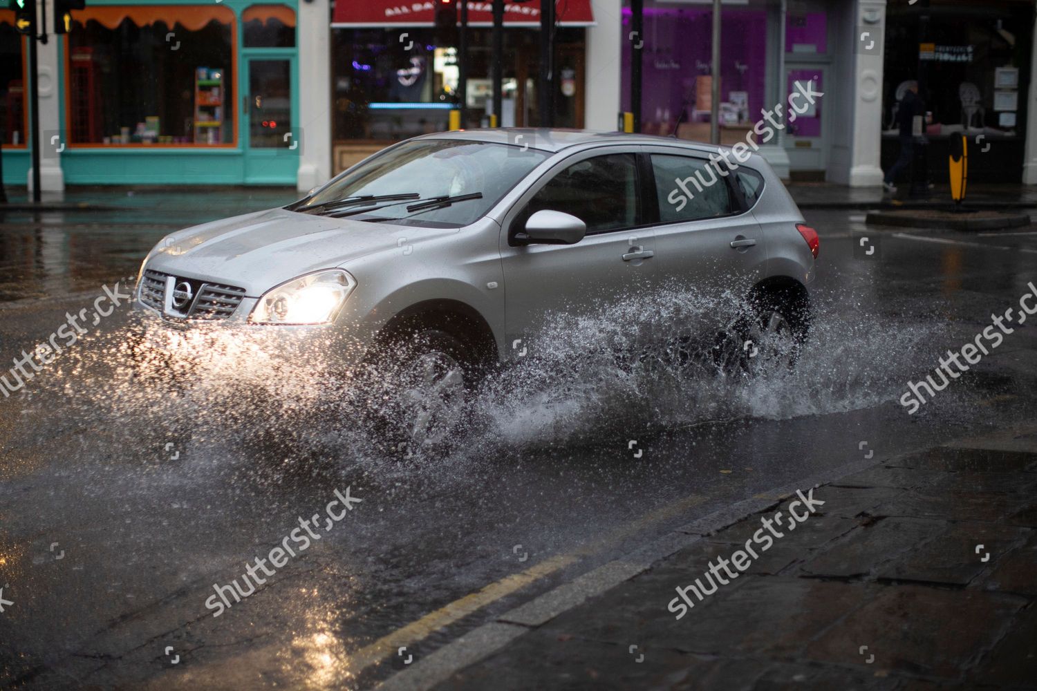 Car Drives Through Large Puddle During Editorial Stock Photo - Stock ...