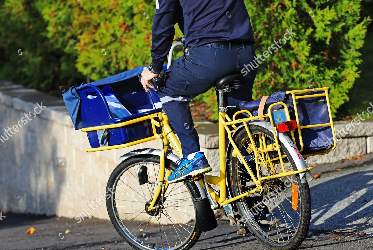 Letter Carrier On Postal Bike Distributes Editorial Stock Photo - Stock ...